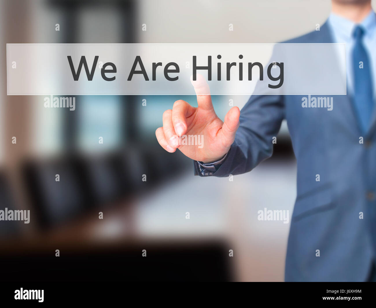 We Are Hiring - Businessman hand pressing button on touch screen ...