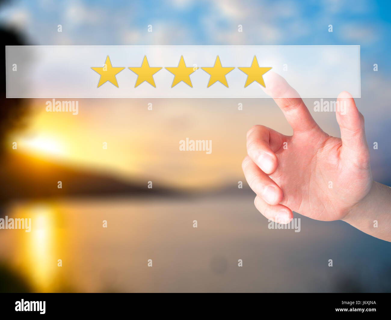 Five star rating - Hand pressing a button on blurred background concept ...