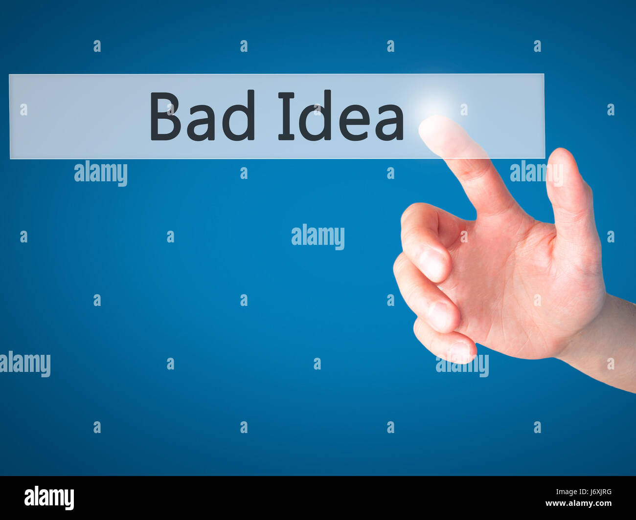 Bad Idea - Hand pressing a button on blurred background concept ...