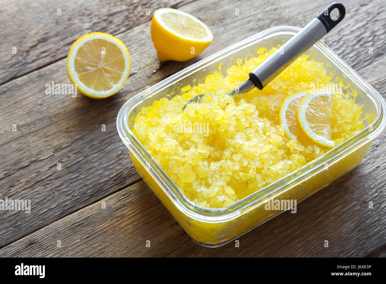 Lemon Frozen Granita Slush Drink on rustic wooden table. Homemade ...