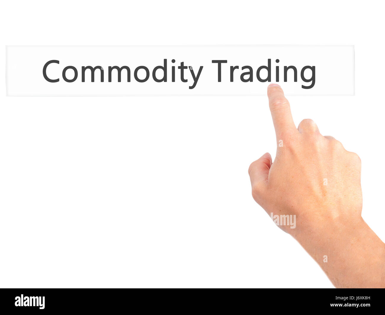 Commodity Trading - Hand pressing a button on blurred background ...