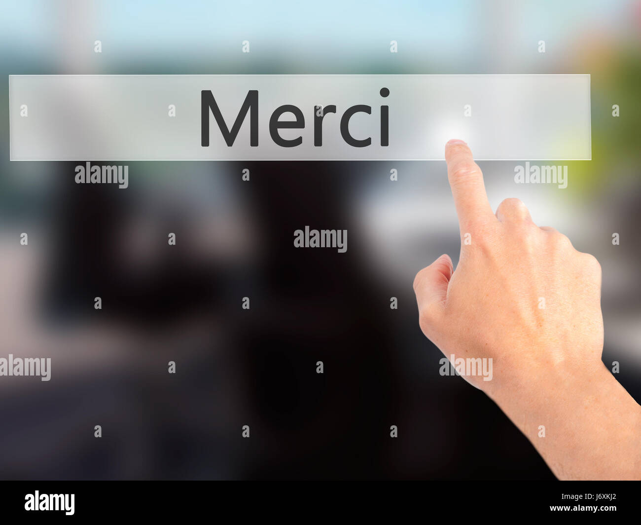 Merci - Hand pressing a button on blurred background concept . Business ...