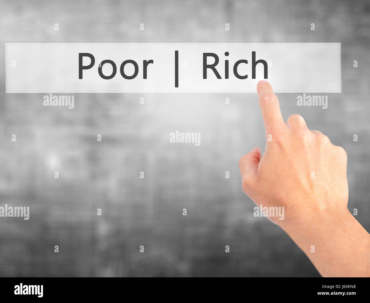 Poor Rich - Hand pressing a button on blurred background concept ...