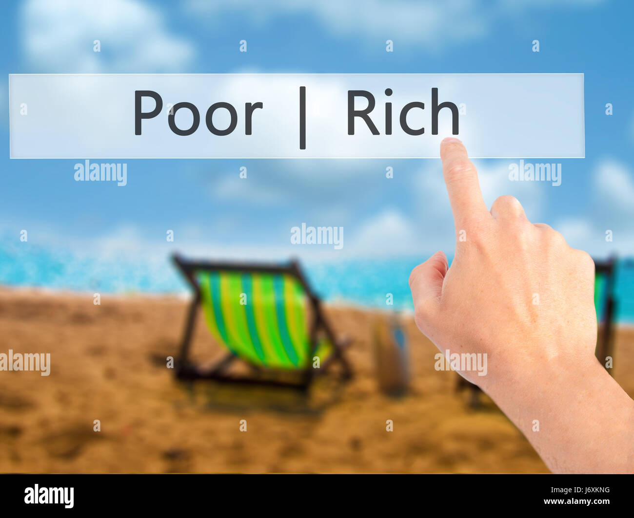 Poor Rich - Hand pressing a button on blurred background concept ...