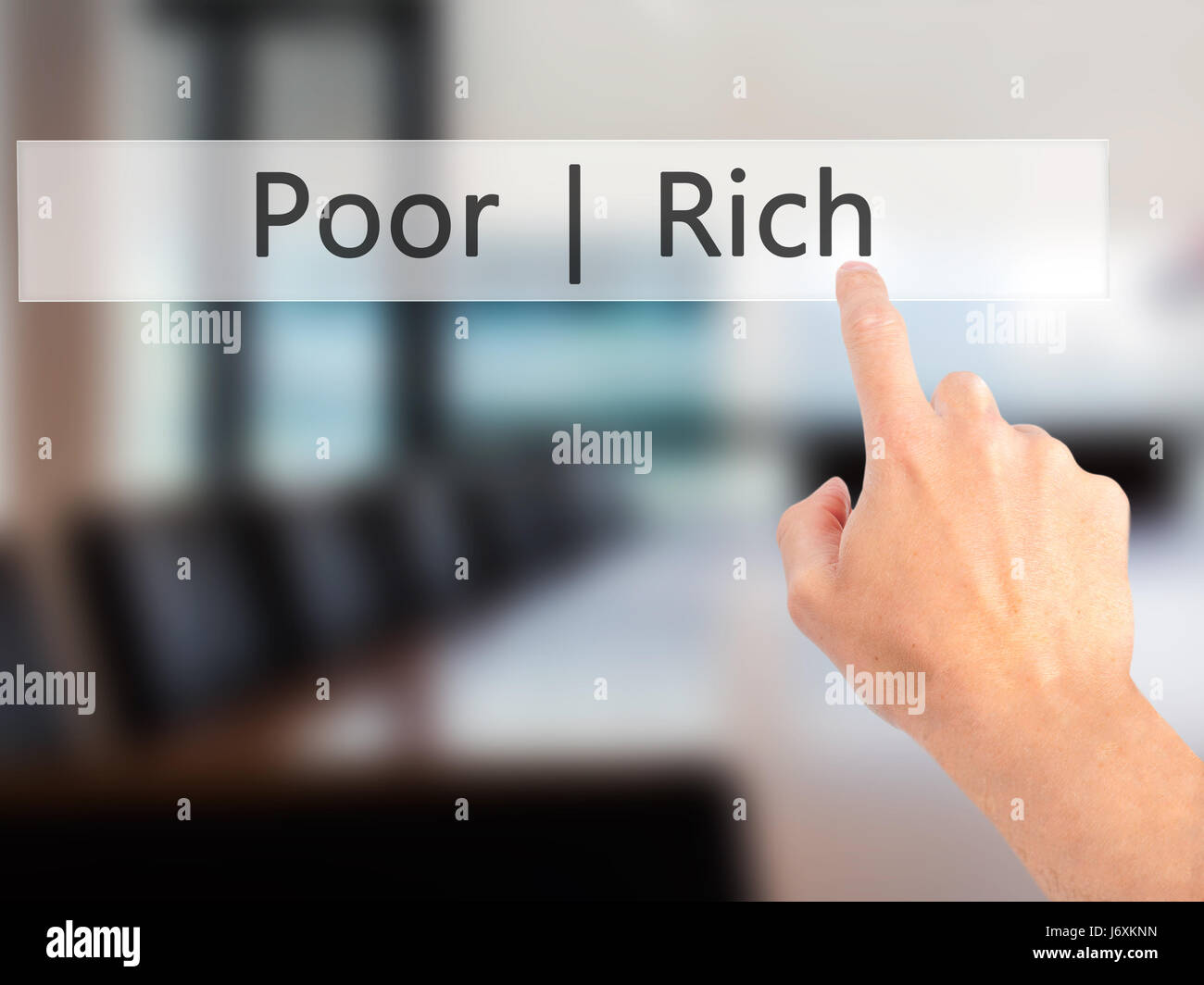 Poor Rich - Hand pressing a button on blurred background concept ...