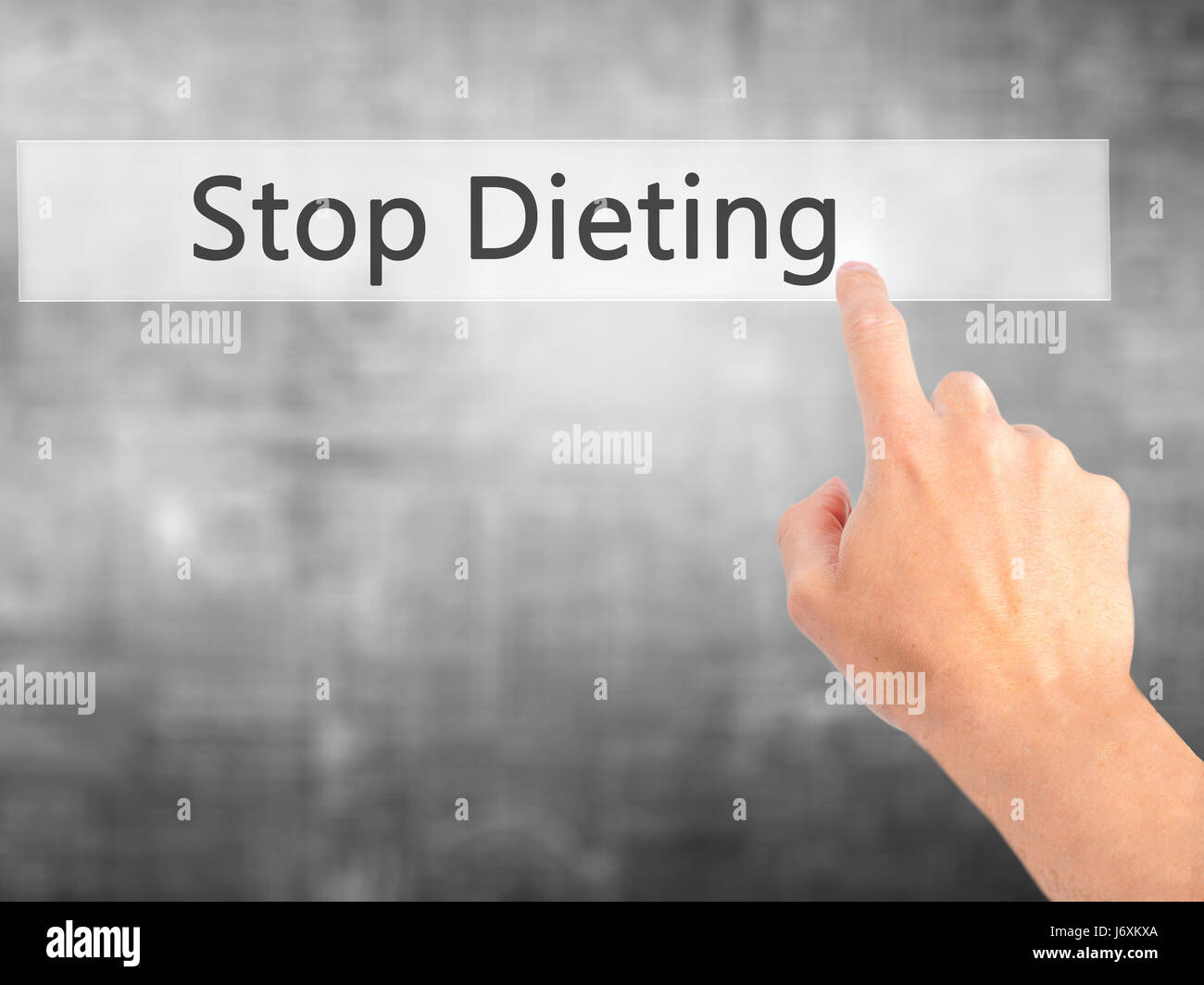 Stop Dieting - Hand pressing a button on blurred background concept ...