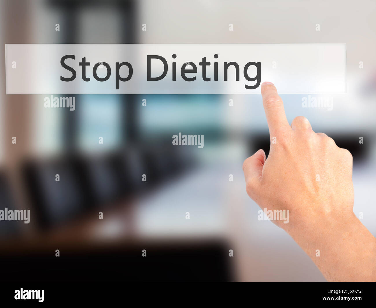 Stop Dieting - Hand pressing a button on blurred background concept ...