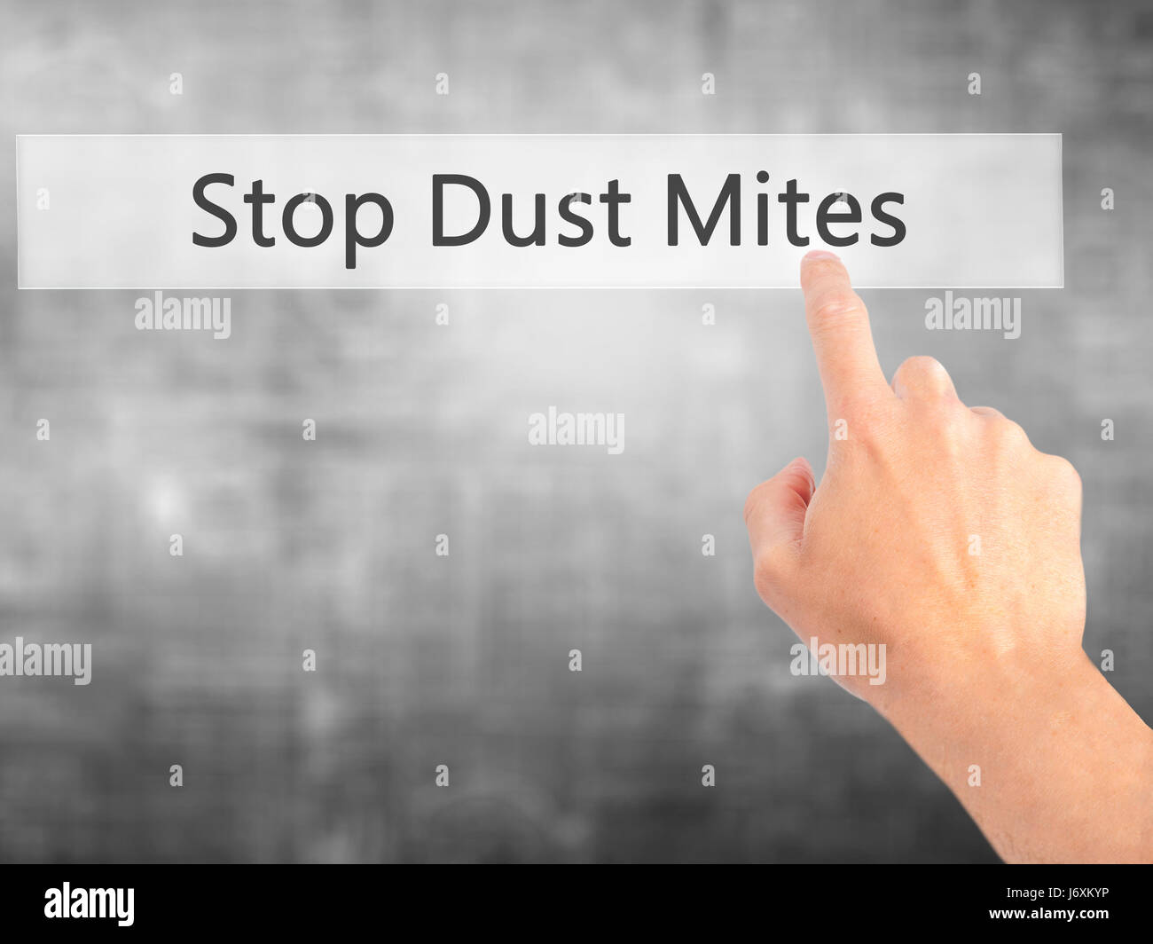 Stop Dust Mites - Hand pressing a button on blurred background concept ...