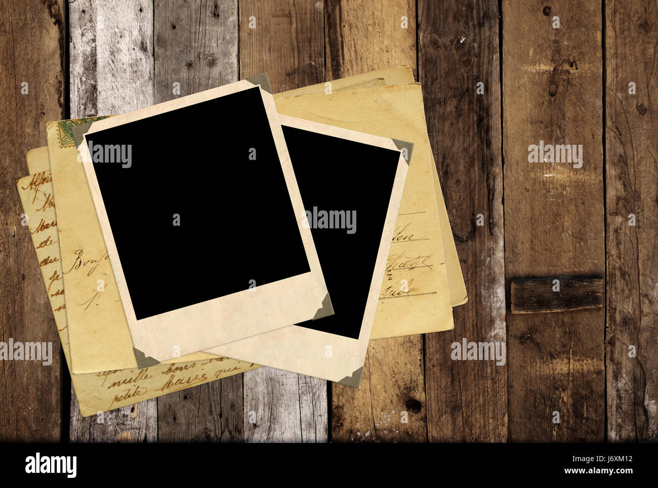 Vintage photo and post cards on old wooden boards of brown colors ...