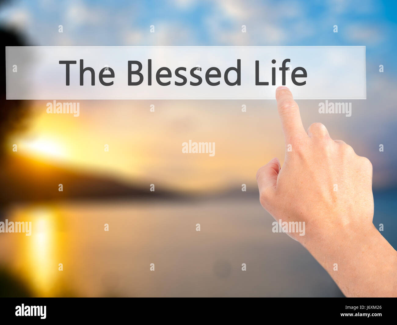 The Blessed Life - Hand pressing a button on blurred background concept ...