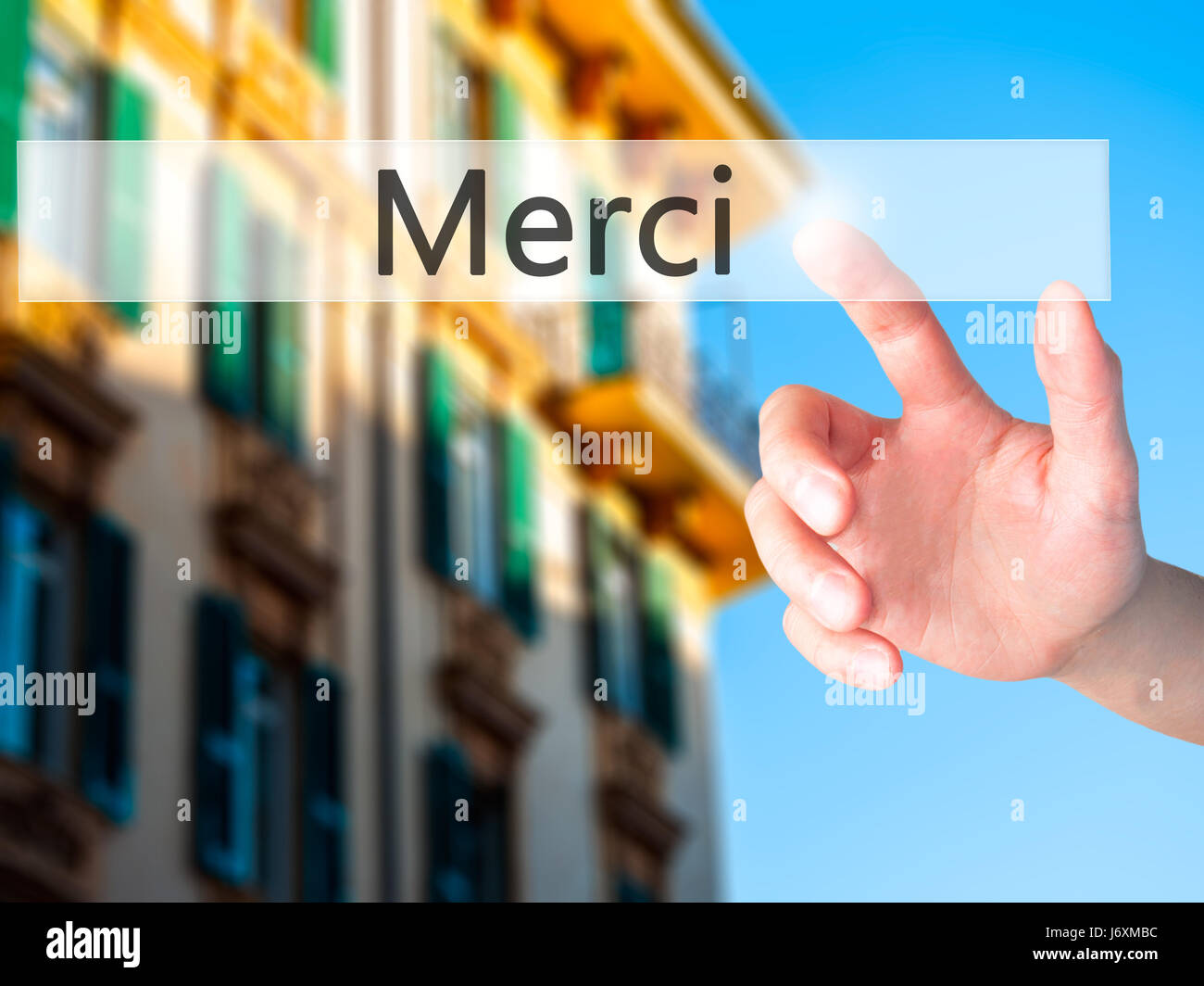 Merci - Hand pressing a button on blurred background concept . Business ...