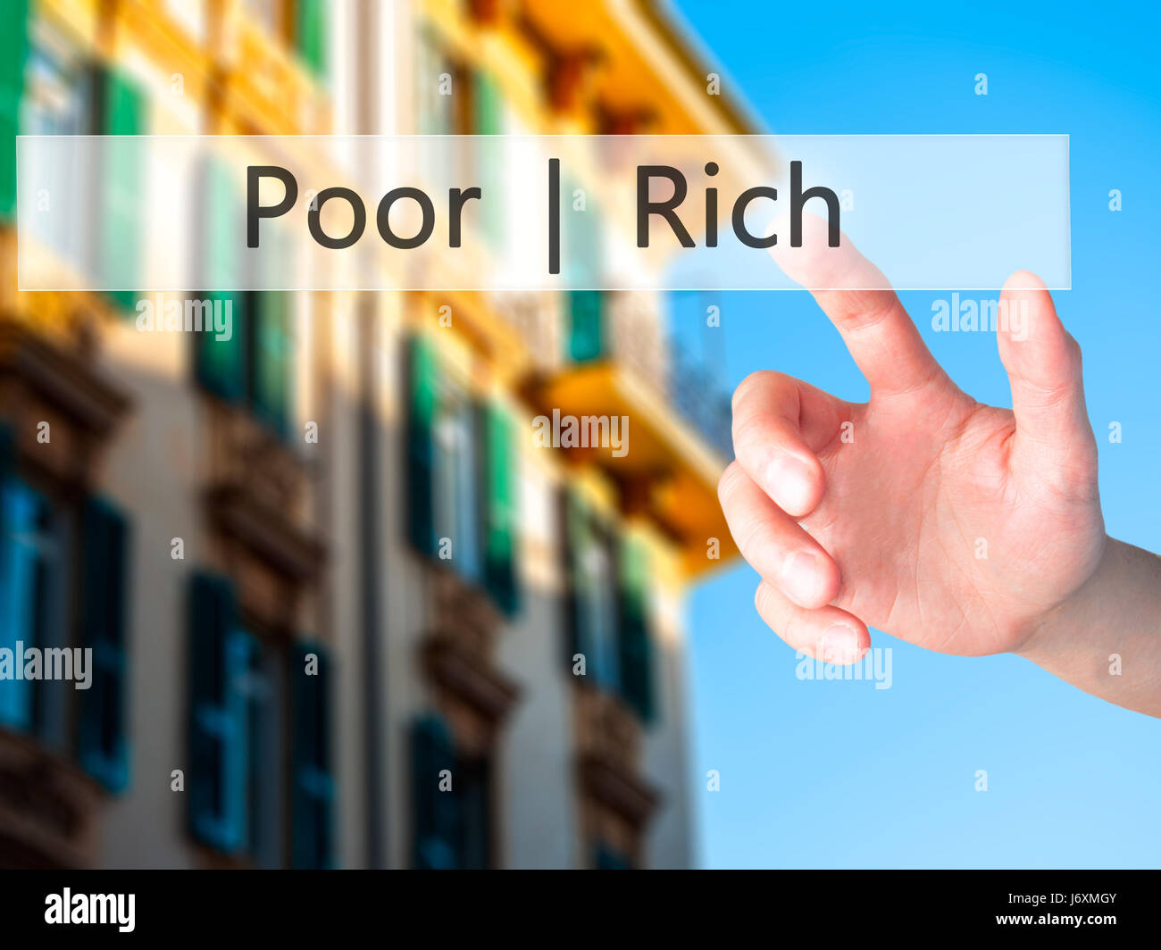 Poor Rich - Hand pressing a button on blurred background concept ...