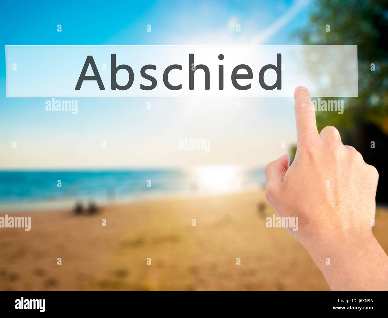 Abschied (Farewell in German) - Hand pressing a button on blurred ...