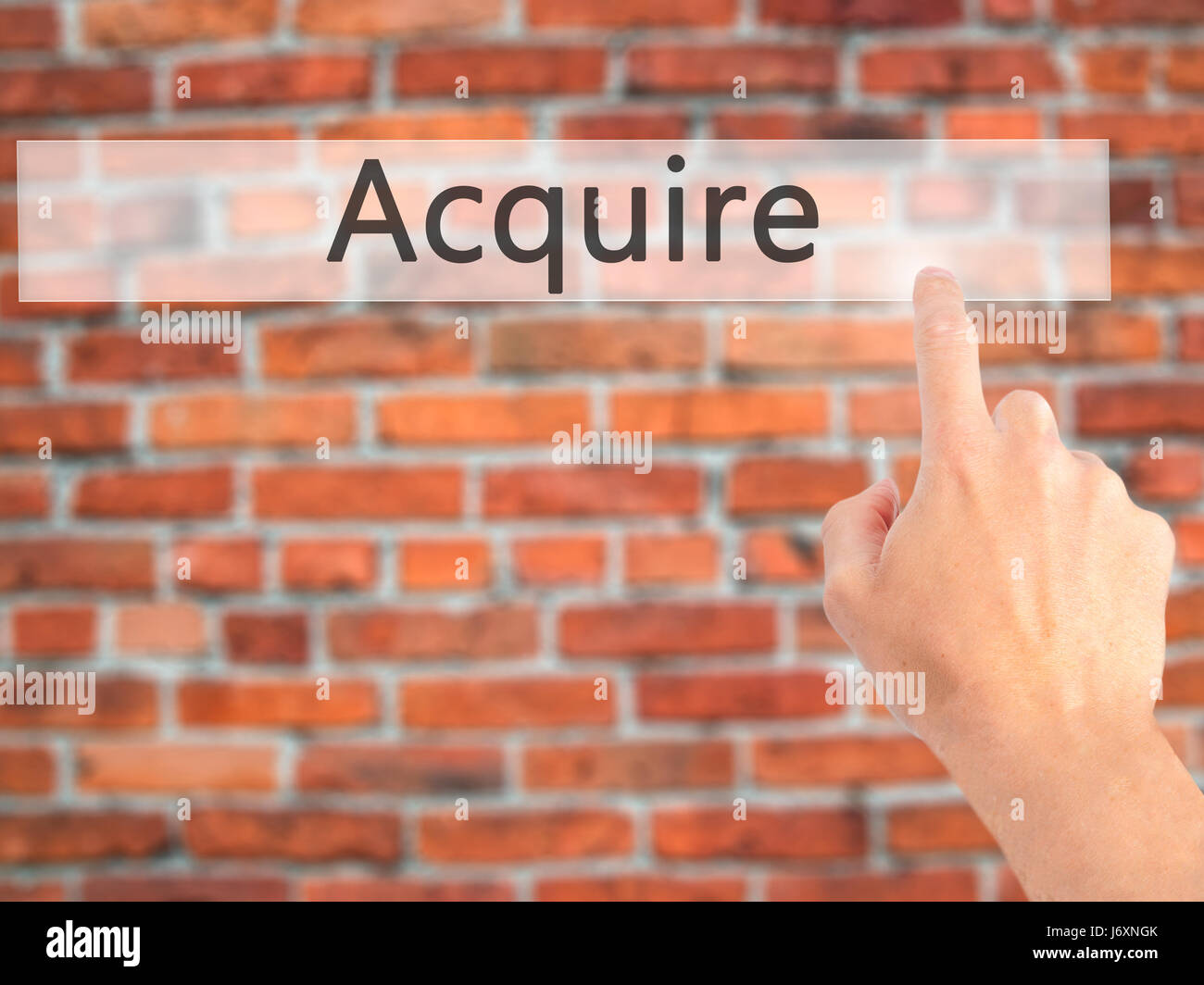 Acquire - Hand pressing a button on blurred background concept ...