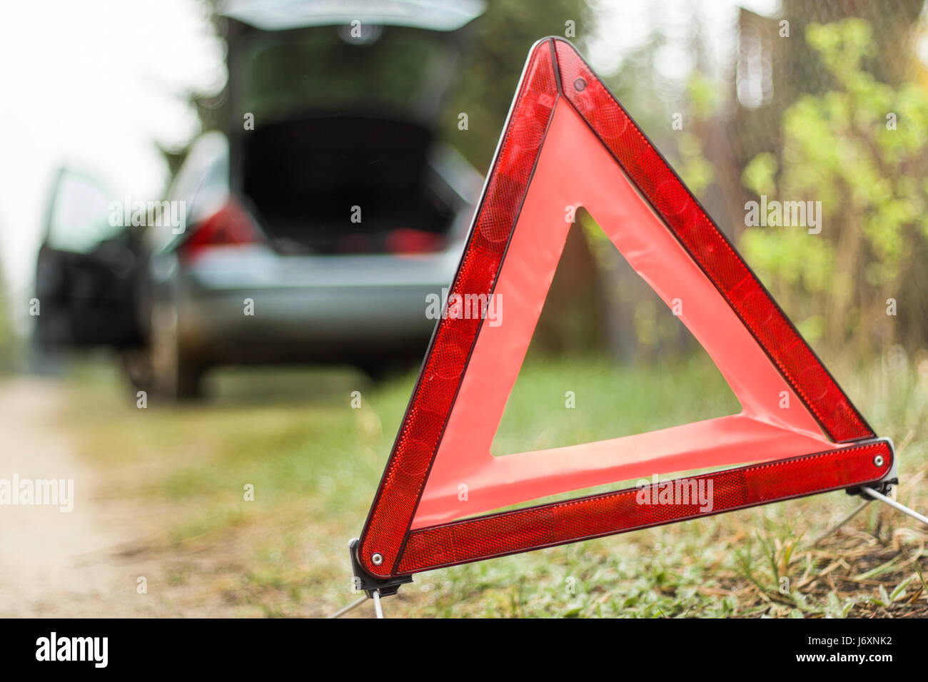 Warning triangle Car breakdown Broken down car. A broken car on the ...