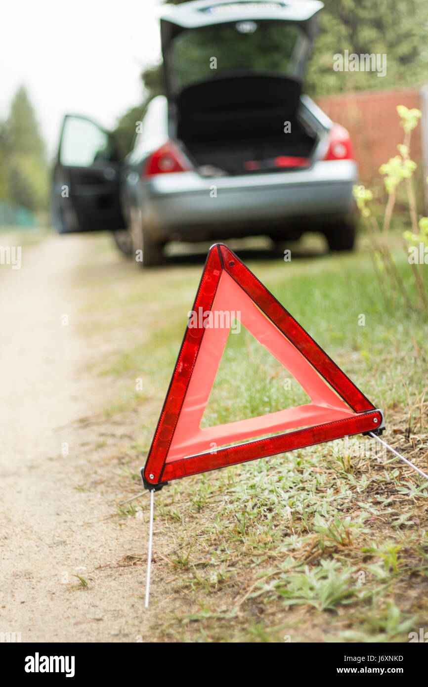 Warning triangle Car breakdown Broken down car. A broken car on the ...
