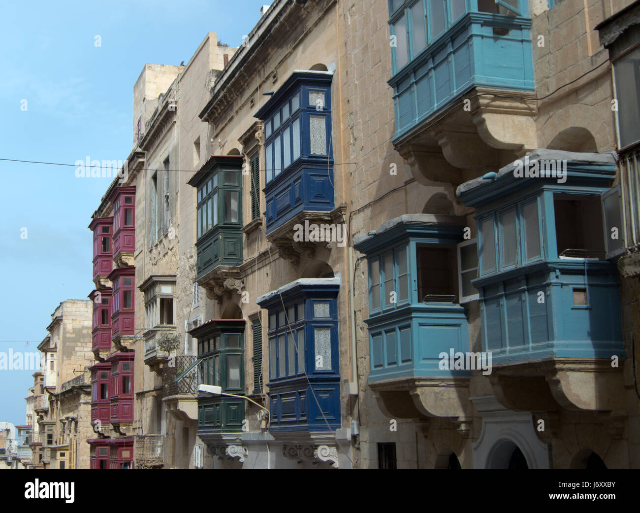 Traditional Maltese window boxes on buildings in Valletta Stock Photo ...