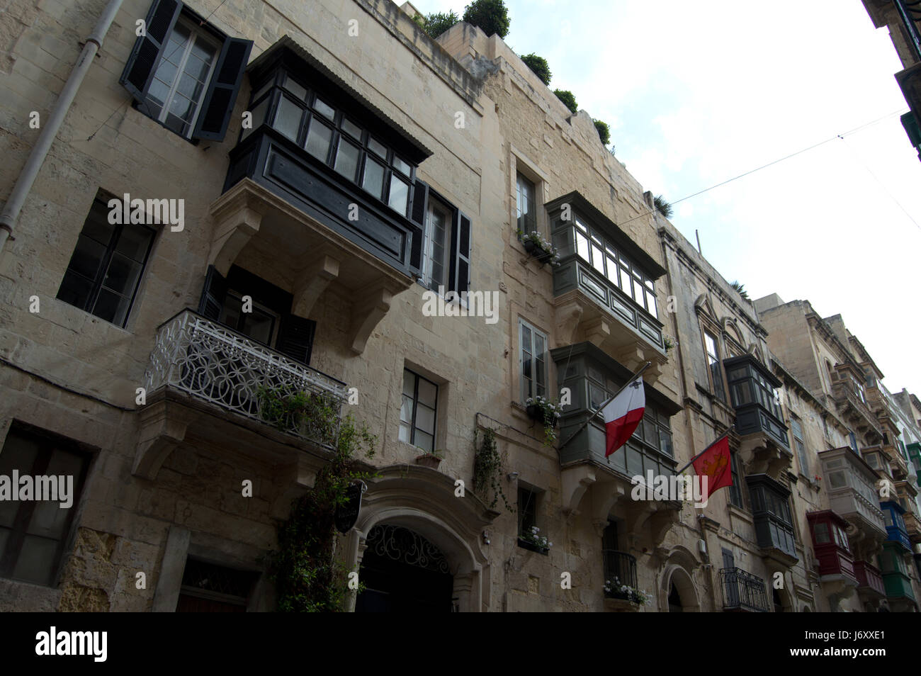 Traditional Maltese window boxes on buildings in Valletta Stock Photo ...