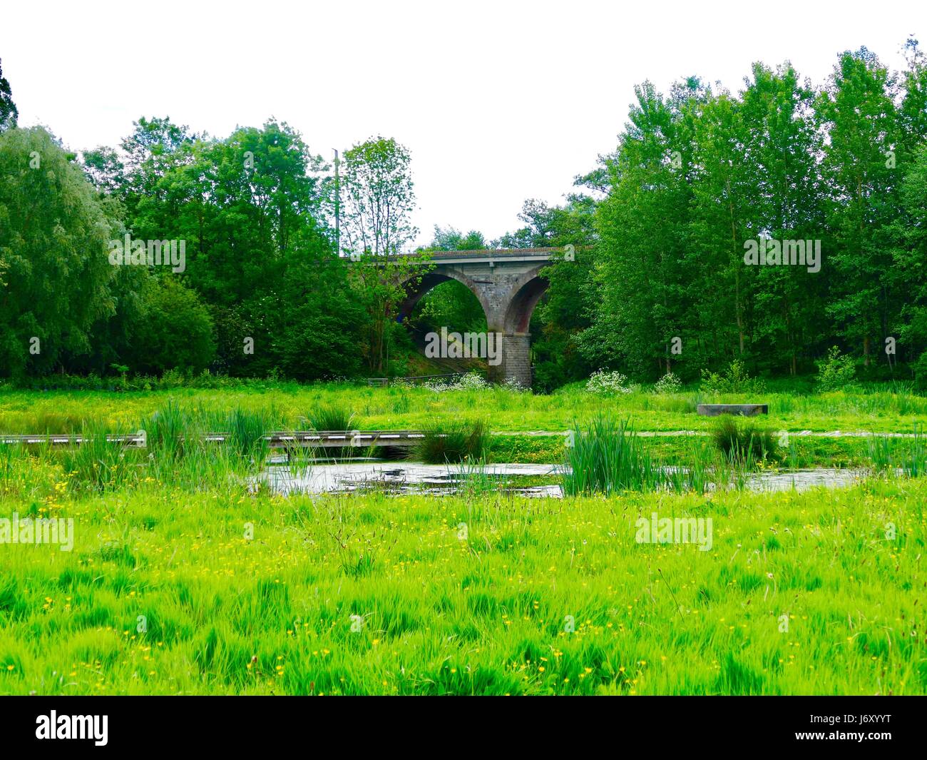 Vallée de l'Aure, wetland park alongside river Aure, with brick train ...