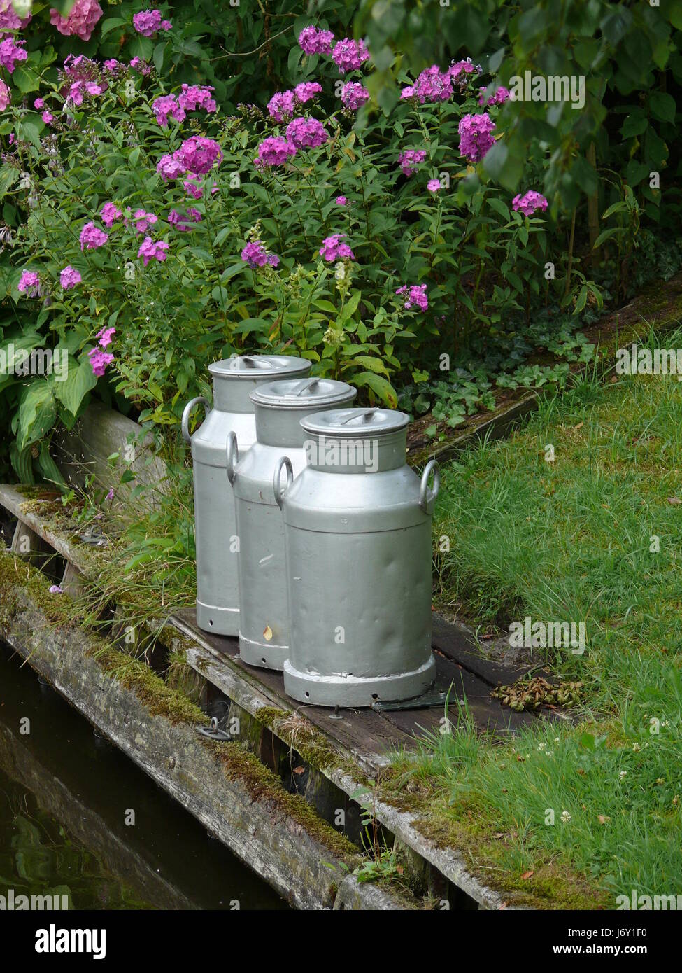 Three milk cans hi-res stock photography and images - Alamy