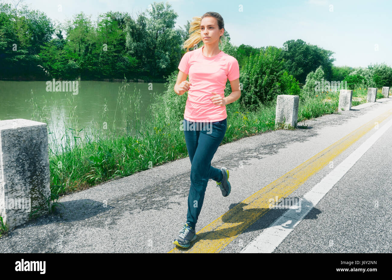 Woman run on the river, fitness Stock Photo - Alamy