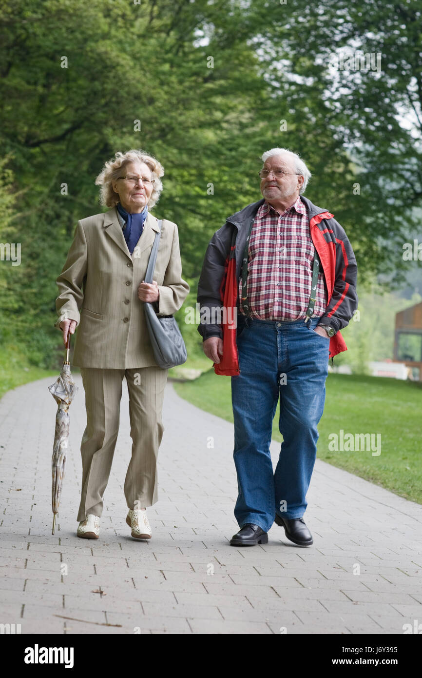 woman walk go going walking park go for a walk couple pair day man ...