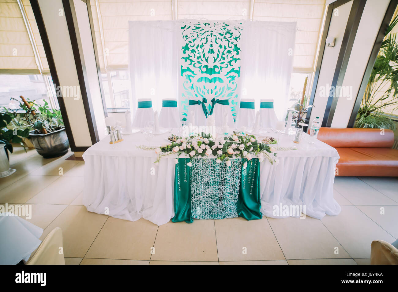 The horizontal view of the wedding table set in blue and white colours ...