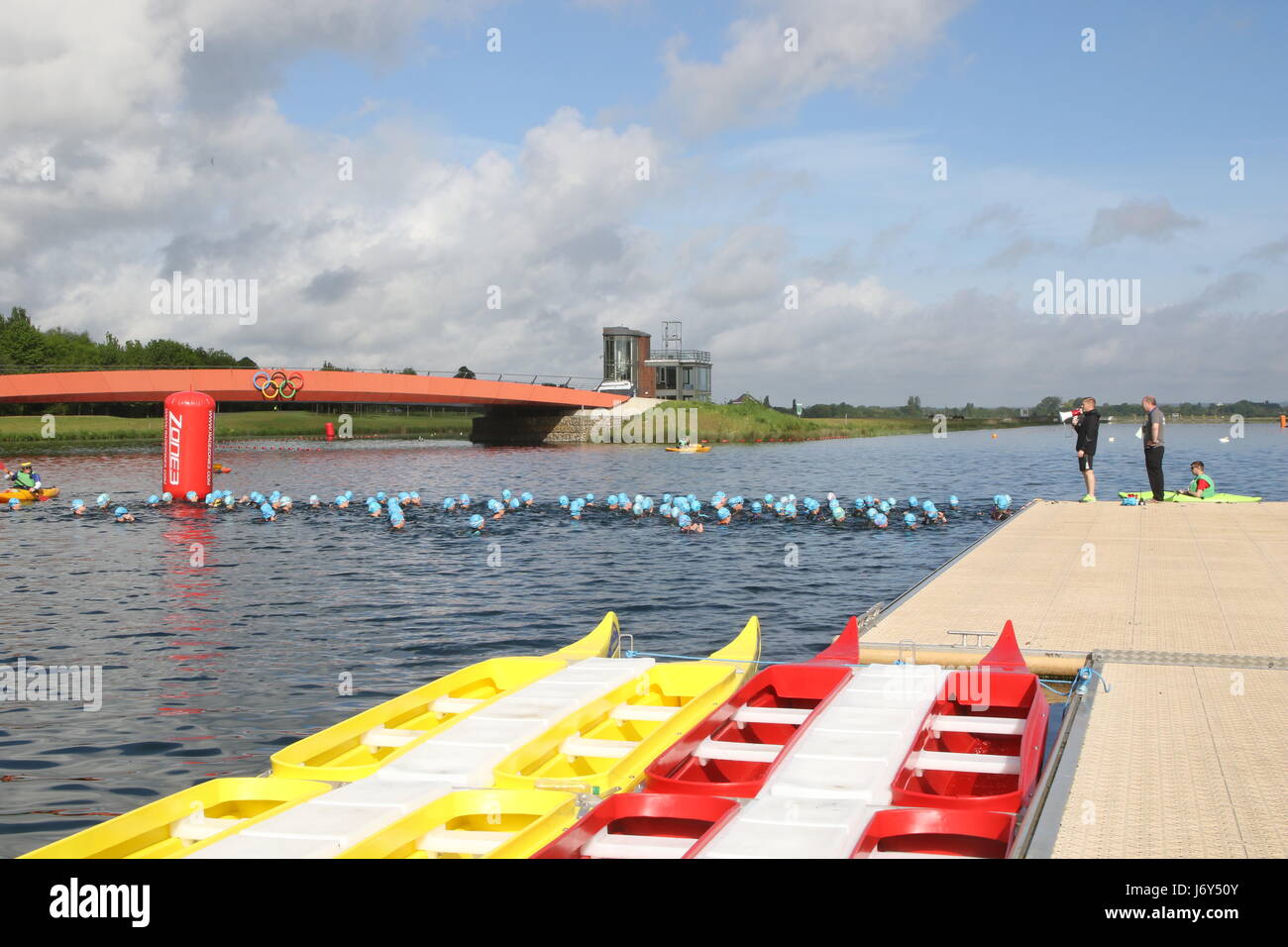A big group of swimmers wait for the starting horn at a triathlon Stock ...