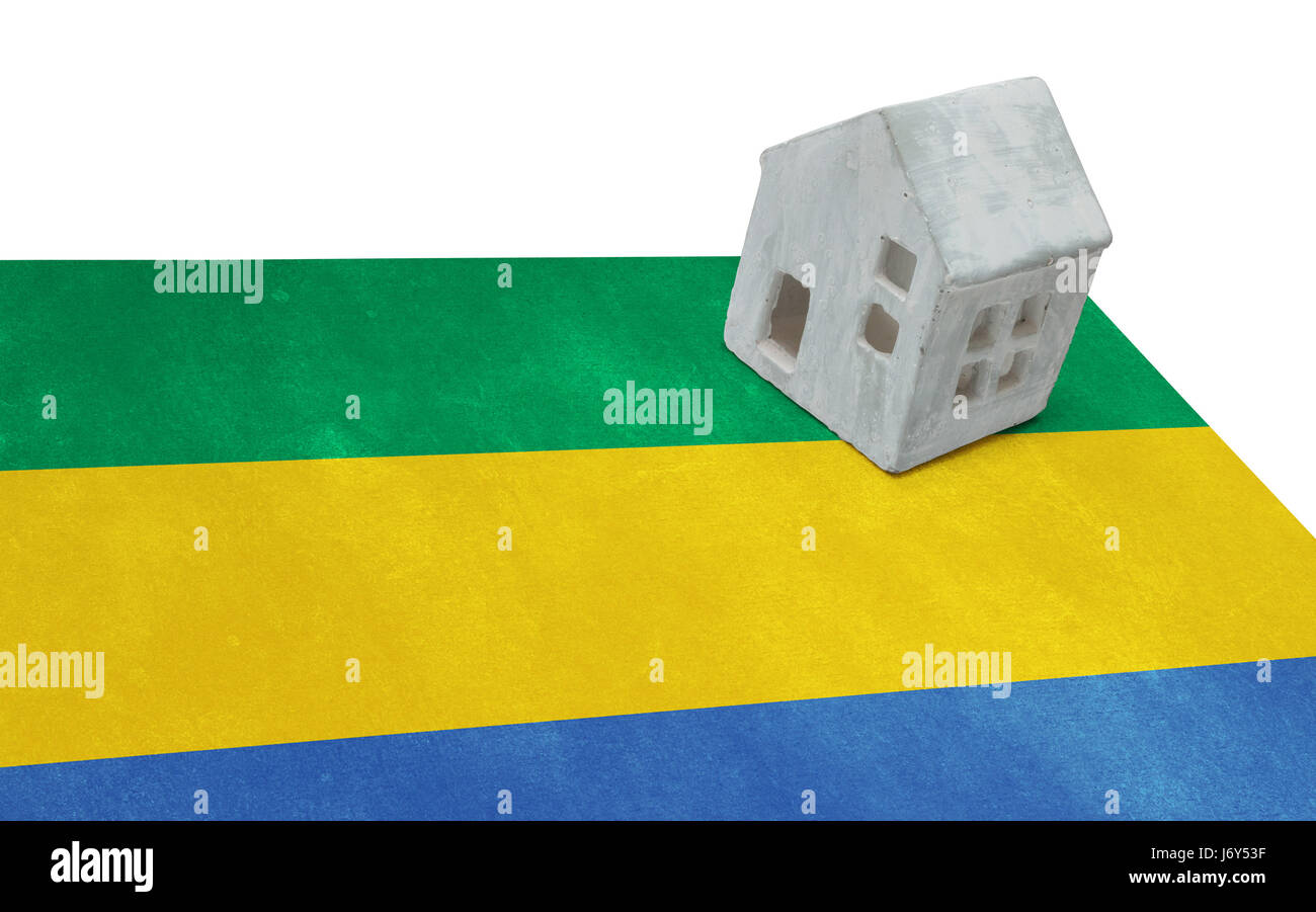 Small house on a flag - Living or migrating to Gabon Stock Photo - Alamy