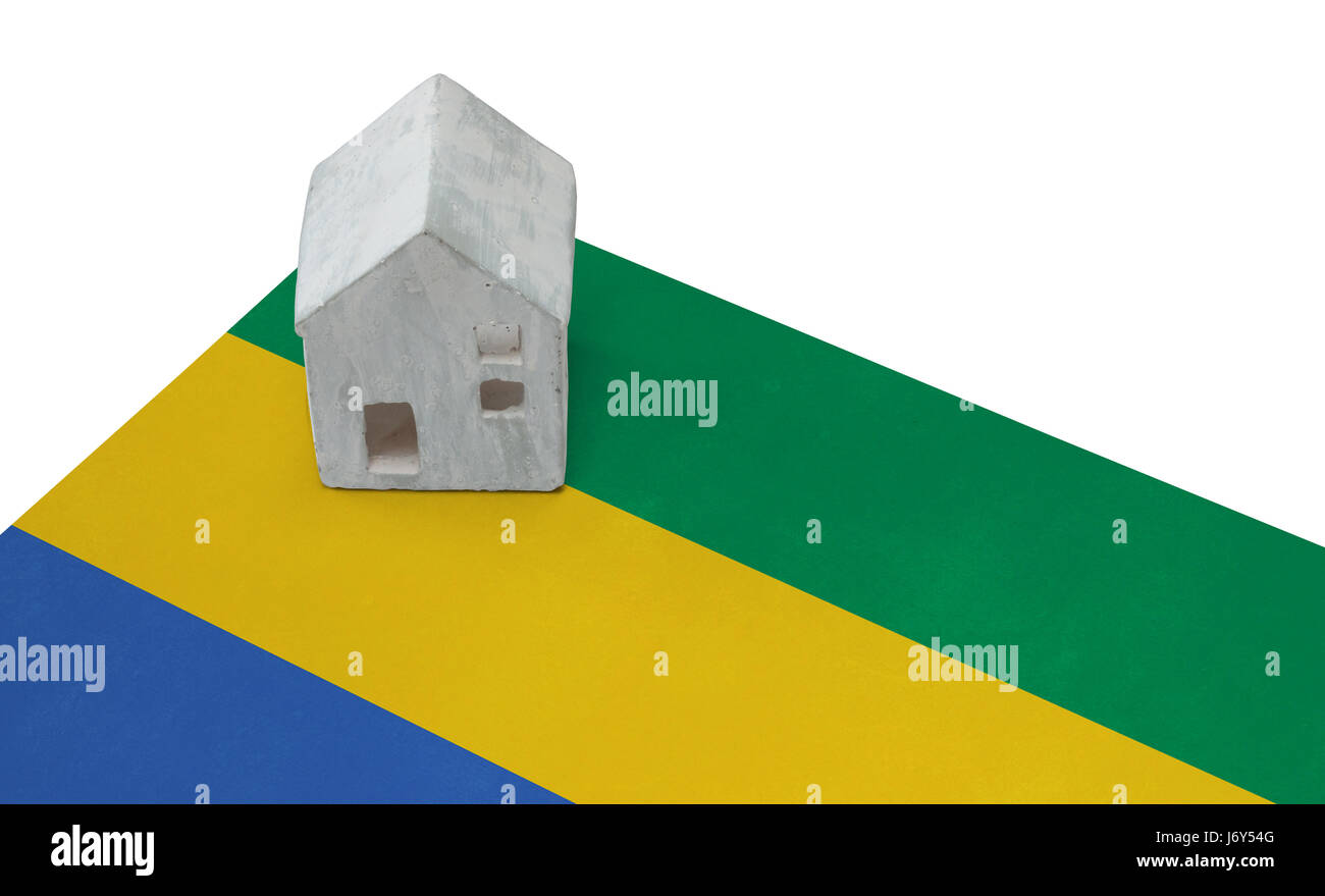 Small house on a flag - Living or migrating to Gabon Stock Photo - Alamy