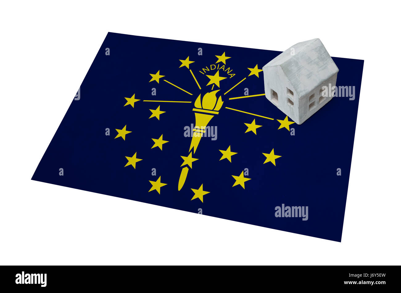 Small house on a flag - Living or migrating to Indiana Stock Photo - Alamy