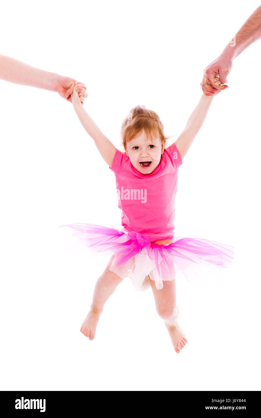 Little laughing girl hanging on parent's hands isolated Stock Photo - Alamy