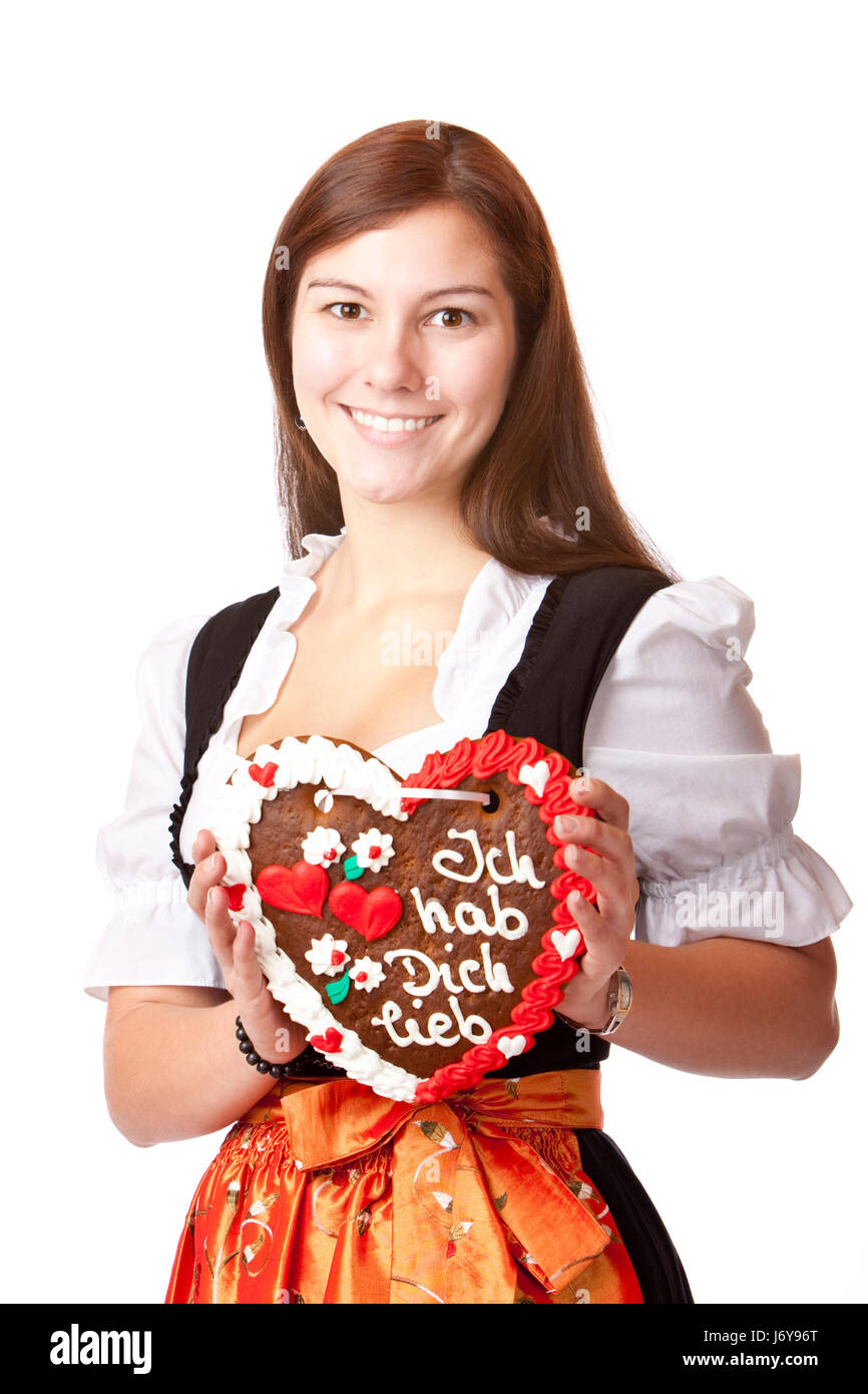 woman in oktoberfest dirndl holds gingerbread heart Stock Photo - Alamy
