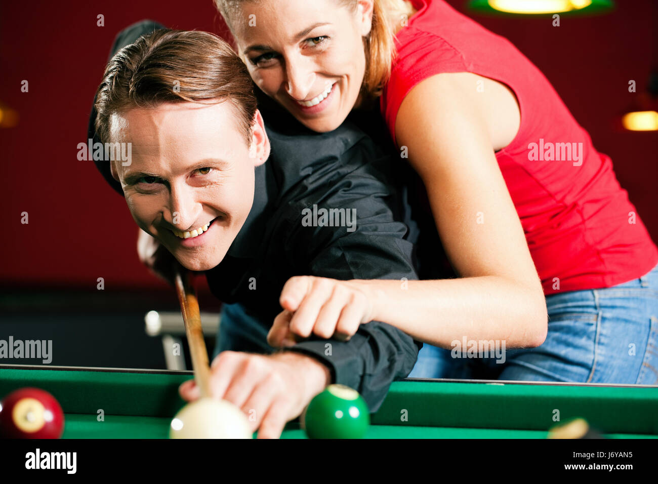 couple playing billiards Stock Photo - Alamy