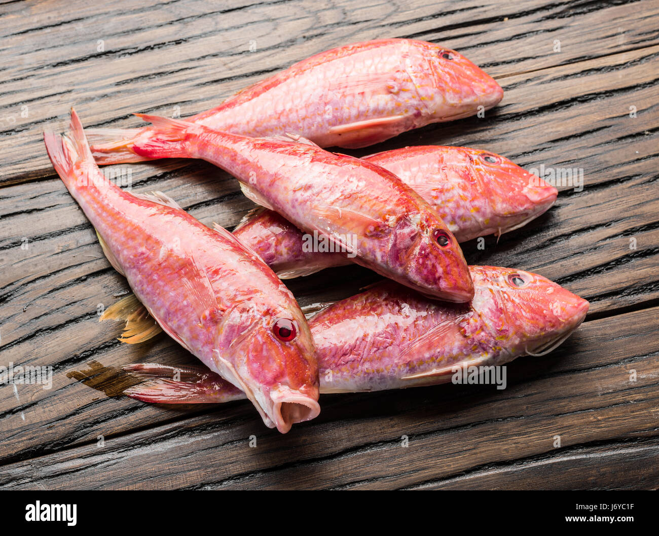 Red mullets on the wooden board Stock Photo - Alamy