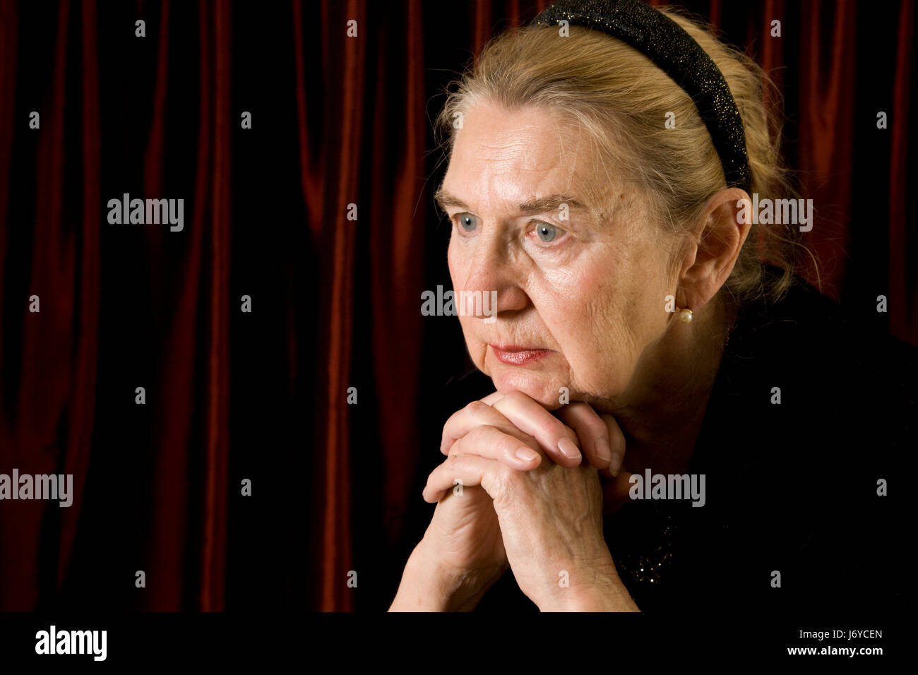 Senior woman peeking hand hi-res stock photography and images - Alamy