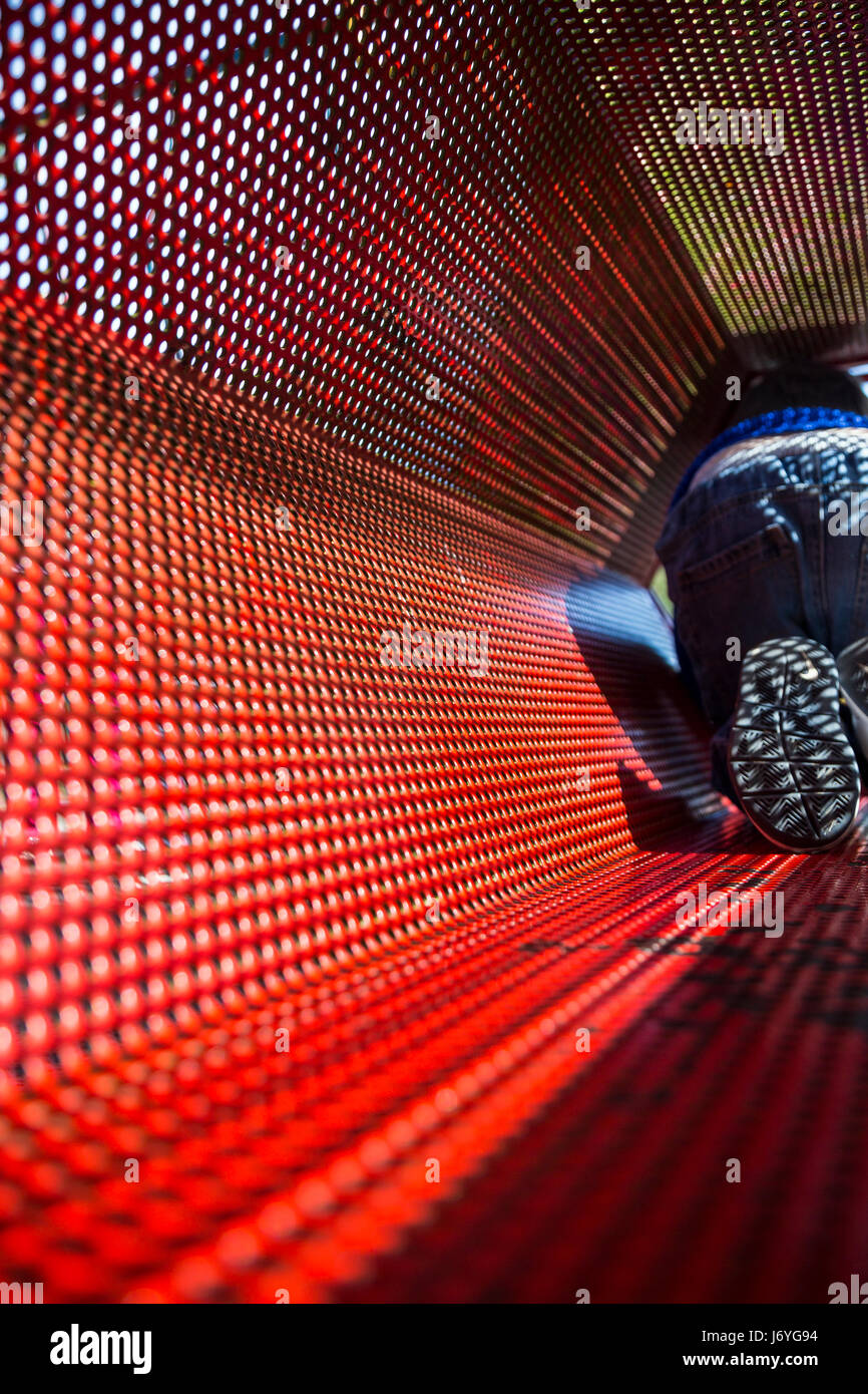 child playing in red play equipment,nonage,sport fool romp Dogs romped ...