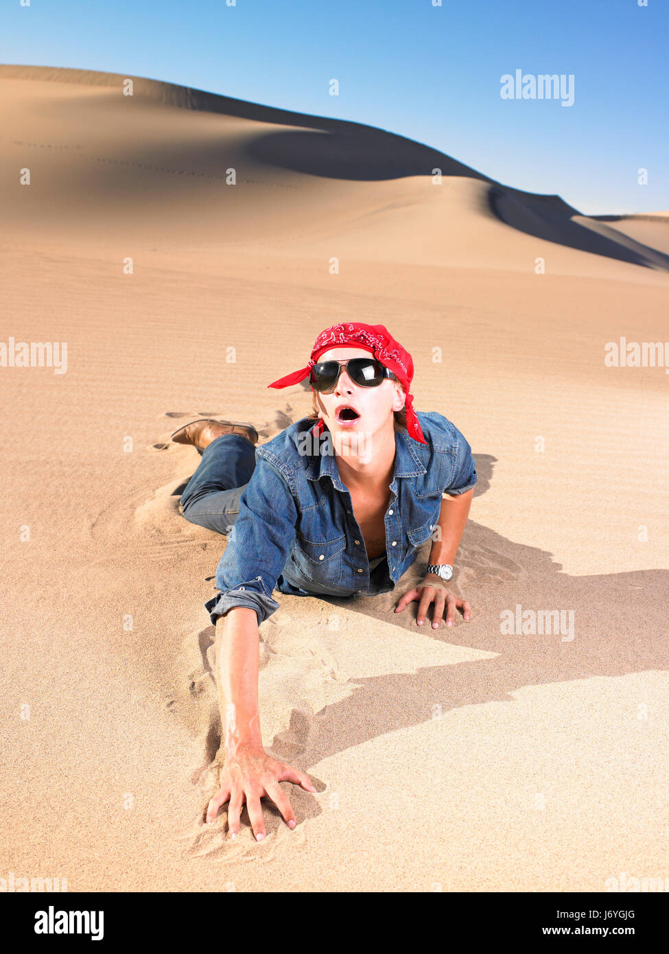 Man Crawling In Desert