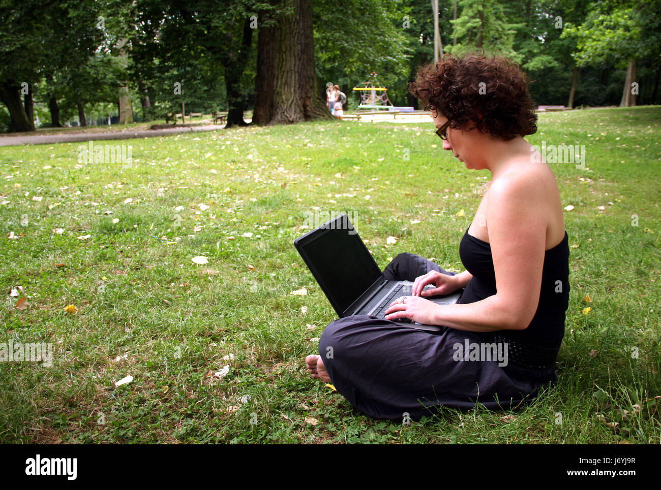 woman laptop notebook computers computer park green meadow lawn woman ...