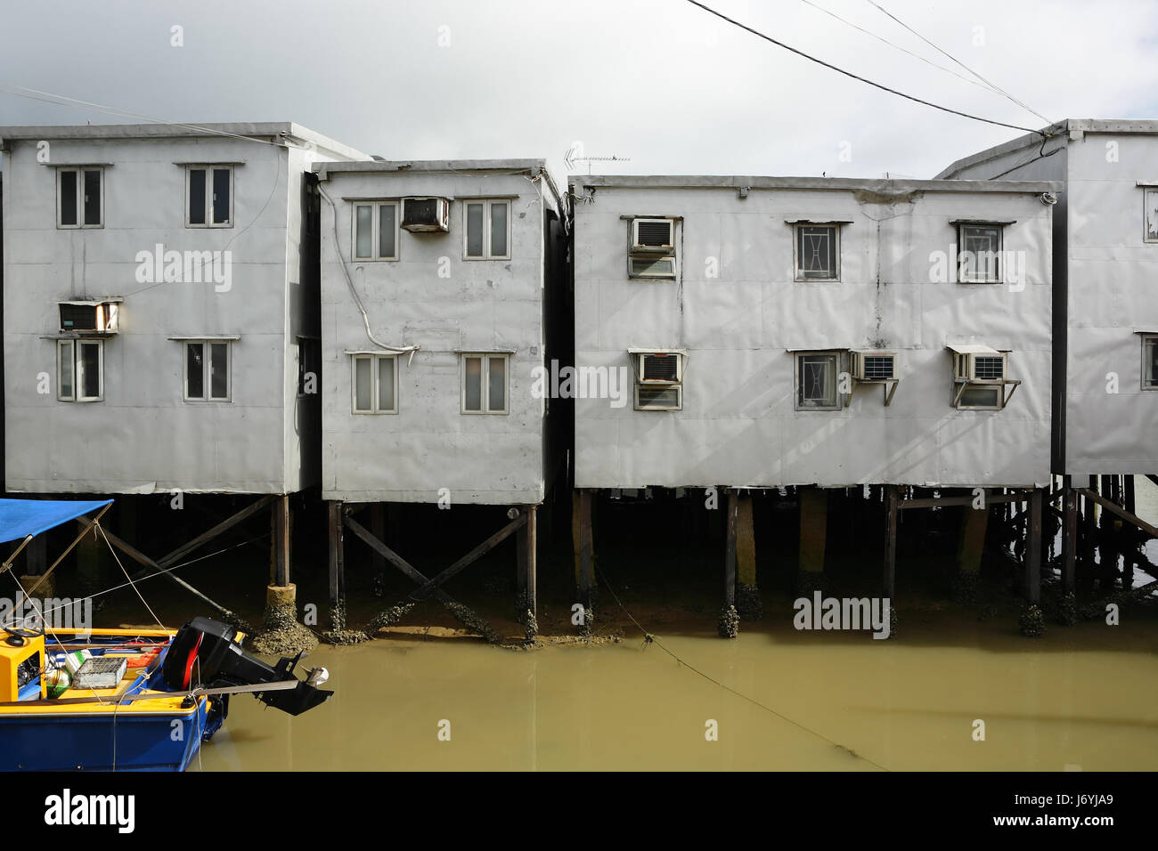 house building fishing stilt community village market town blue house ...