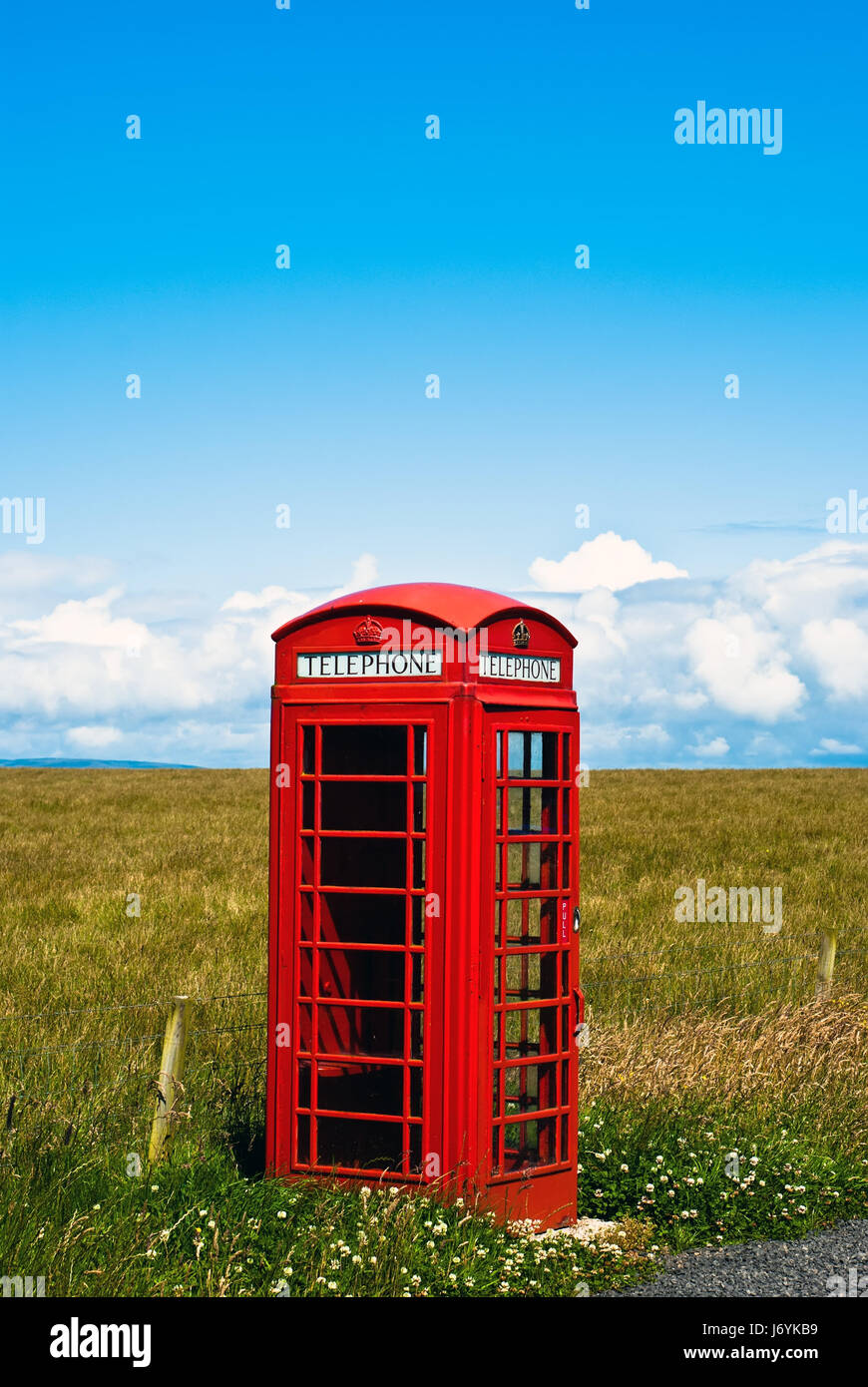 red telephone box isolated in the landscape v2 Stock Photo - Alamy