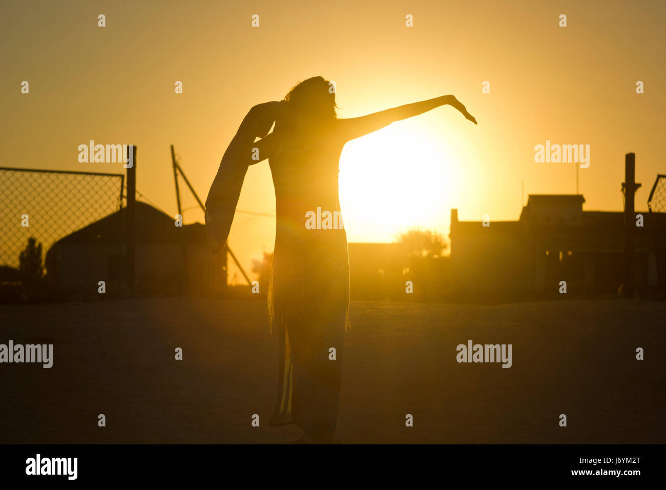 girl's silhouette against the sun at sunset Stock Photo - Alamy