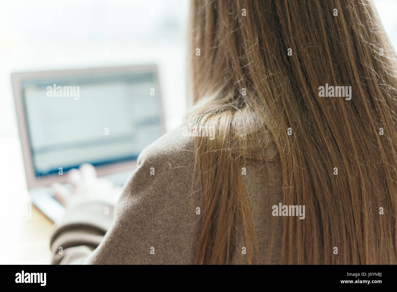Woman young computer rear hi-res stock photography and images - Alamy