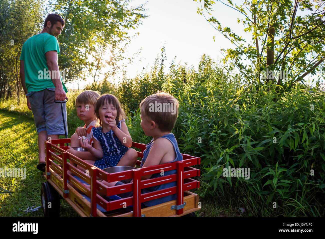 Boy pulling wagon hi-res stock photography and images - Alamy