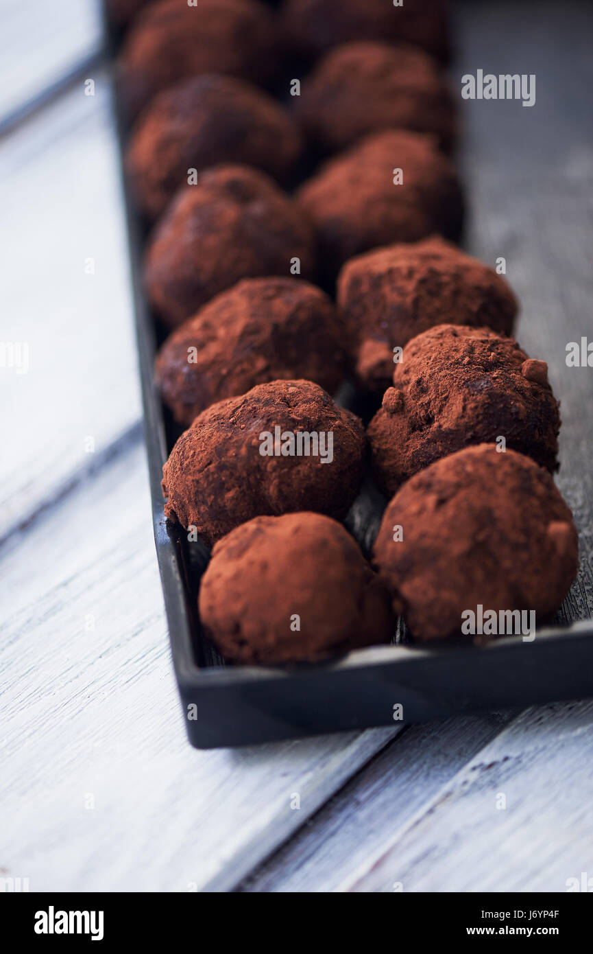 A lot of delicious round chocolate truffles. A work of culinary art ...