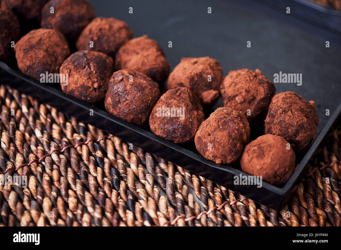 A lot of delicious round chocolate truffles. A work of culinary art ...