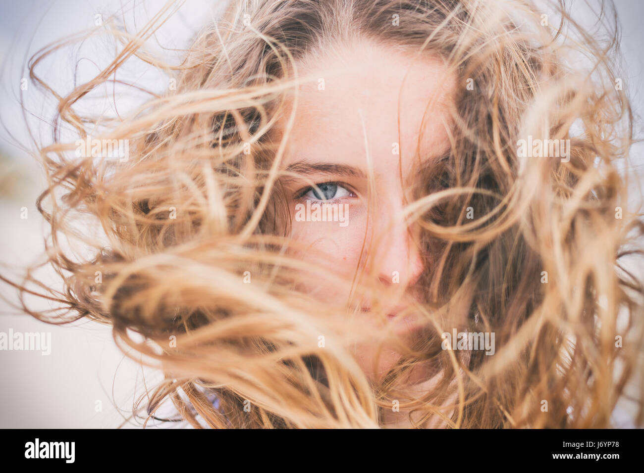Portrait of a girl with windswept hair Stock Photo - Alamy