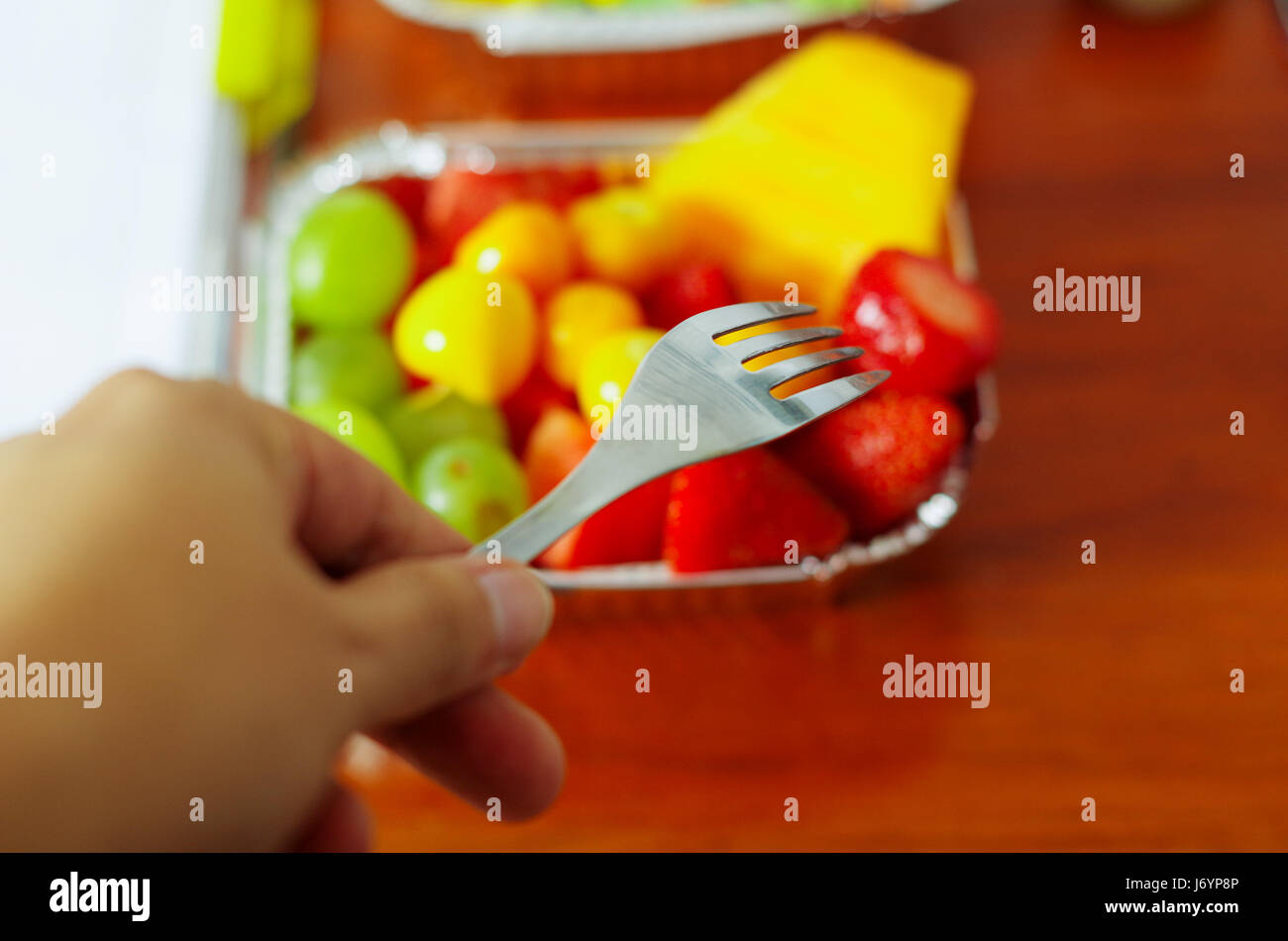 Using fork eat fresh fruit hi-res stock photography and images - Alamy