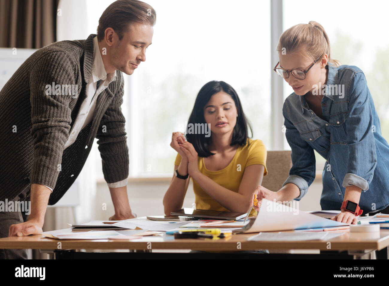 Hard working nice designers concentrating on their work Stock Photo - Alamy