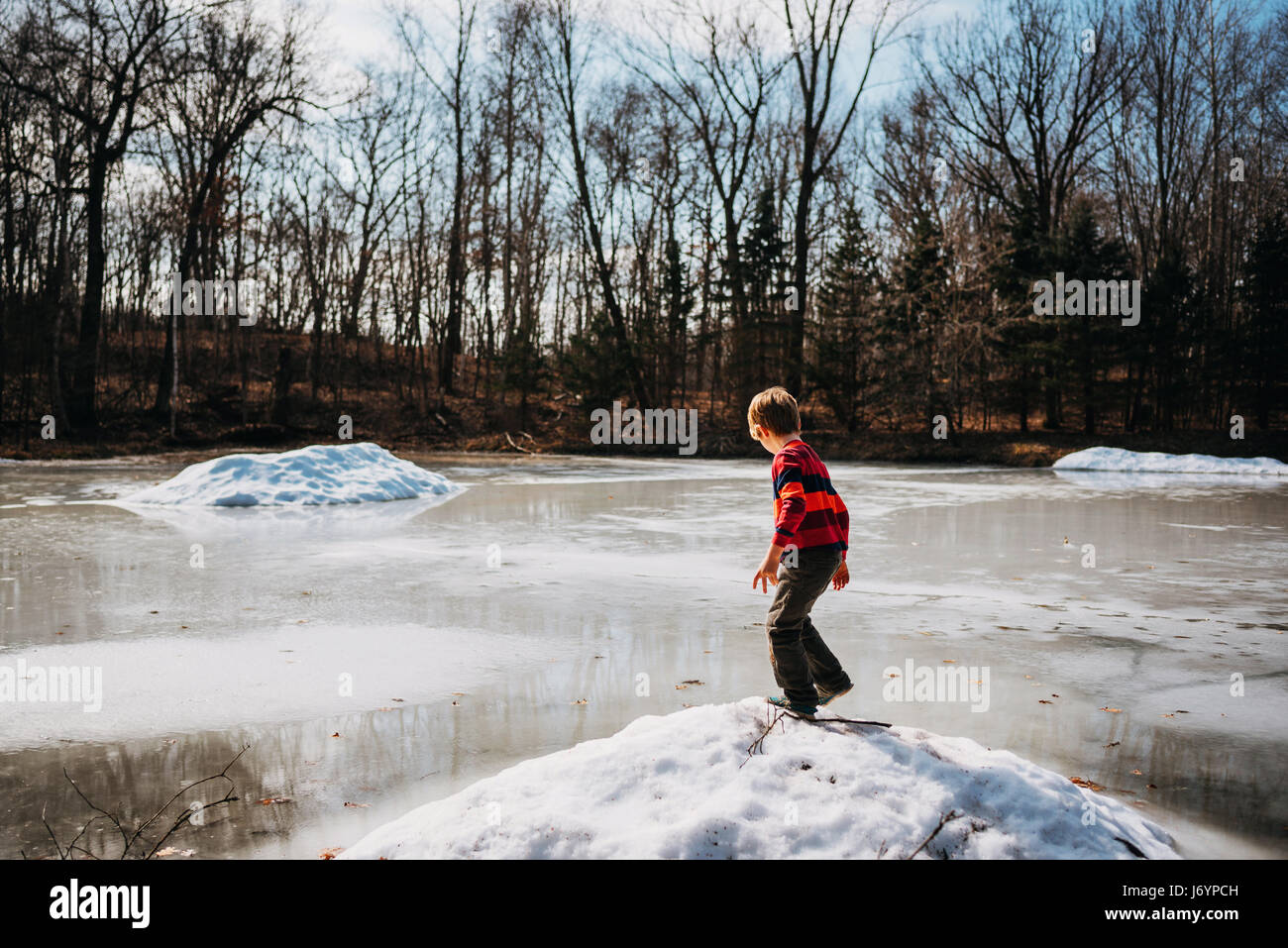 Boy standing in pond hi-res stock photography and images - Alamy